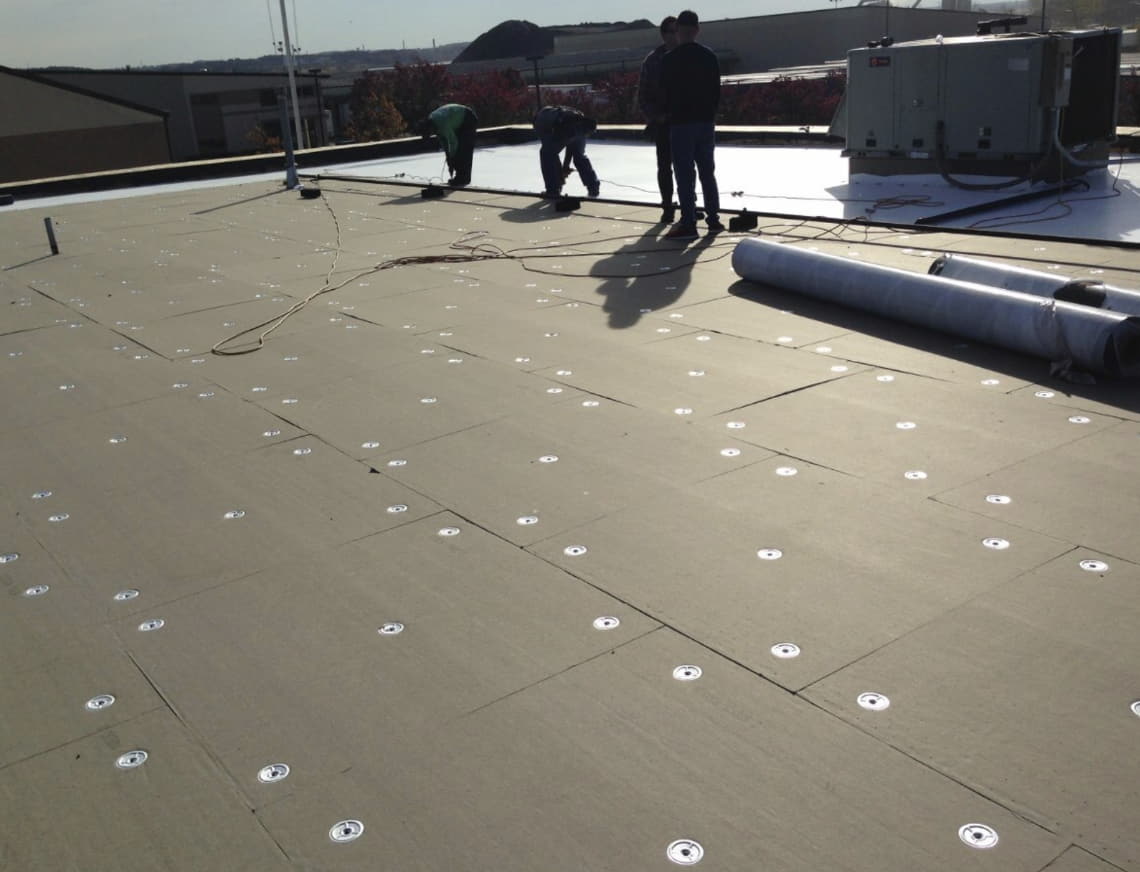 The Effect of Sloped Insulation on Flat Roof Dynamics